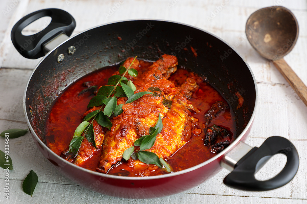 Spicy Mackerel fish curry gravy , cooking spicy Kerala fish curry ...
