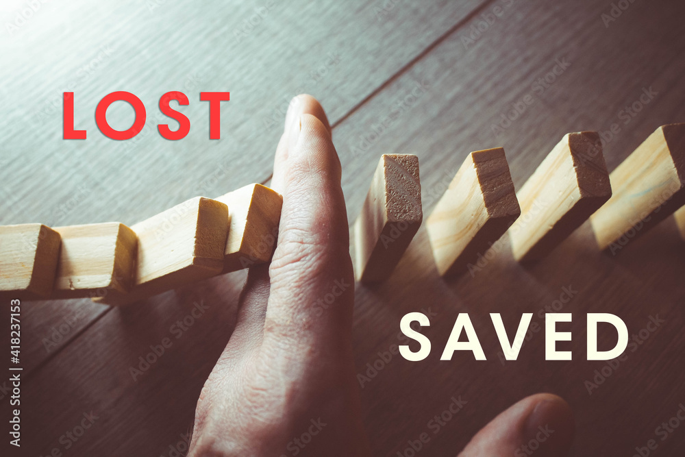 Drop schedule and rescue. Domino principle. Lost and saved. Stock Photo ...