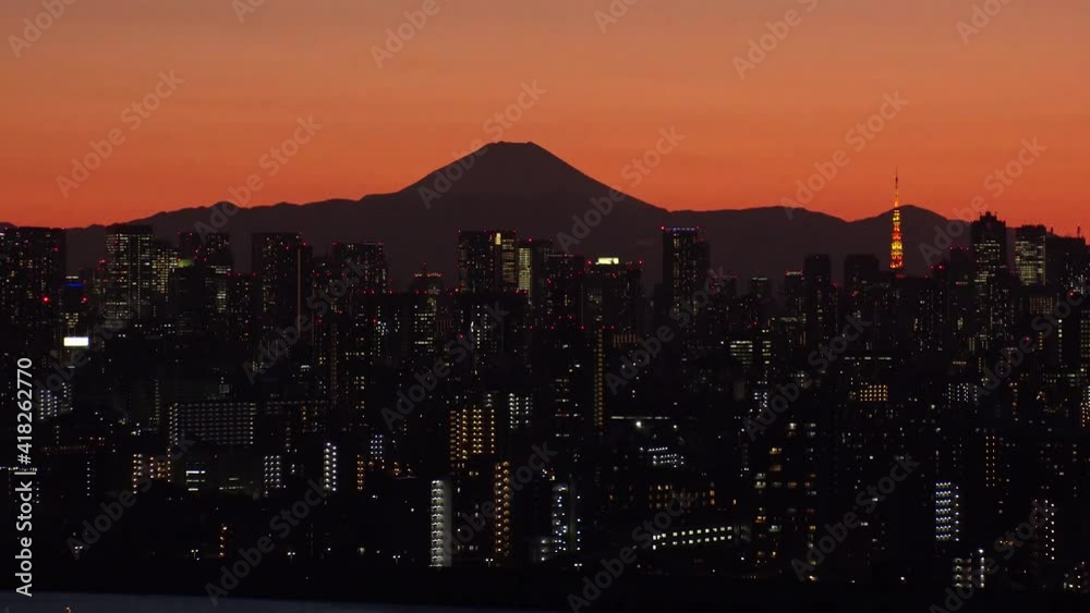TOKYO, JAPAN : Aerial sunset CITYSCAPE of TOKYO and MOUNT FUJI. View of ...