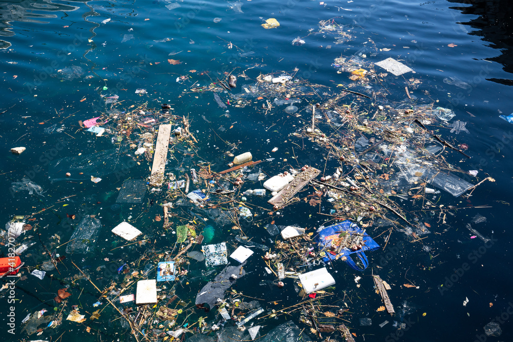 pollution, waste in sea water. Plastic and various waste on the sea ...