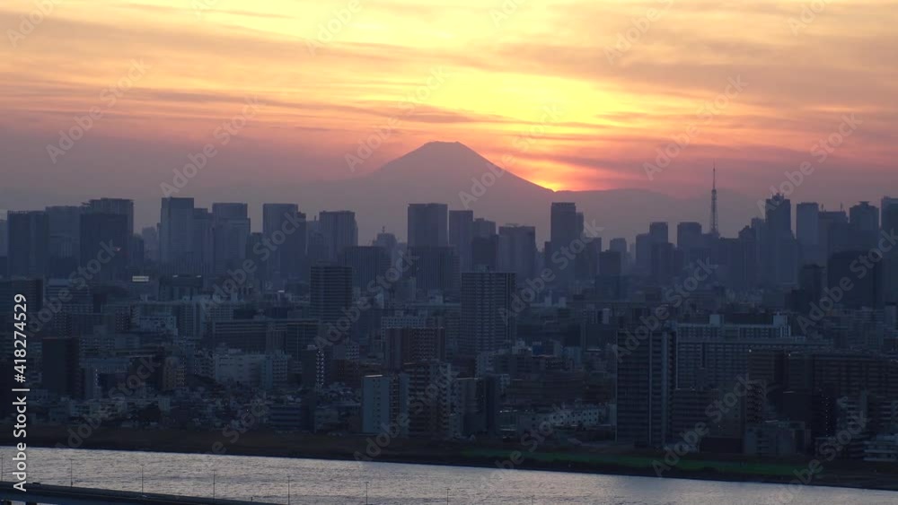 TOKYO, JAPAN : Aerial sunset CITYSCAPE of TOKYO and MOUNT FUJI. View of ...