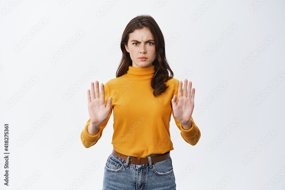 I said no. Serious and angry woman frowning, showing stop gesture to ...