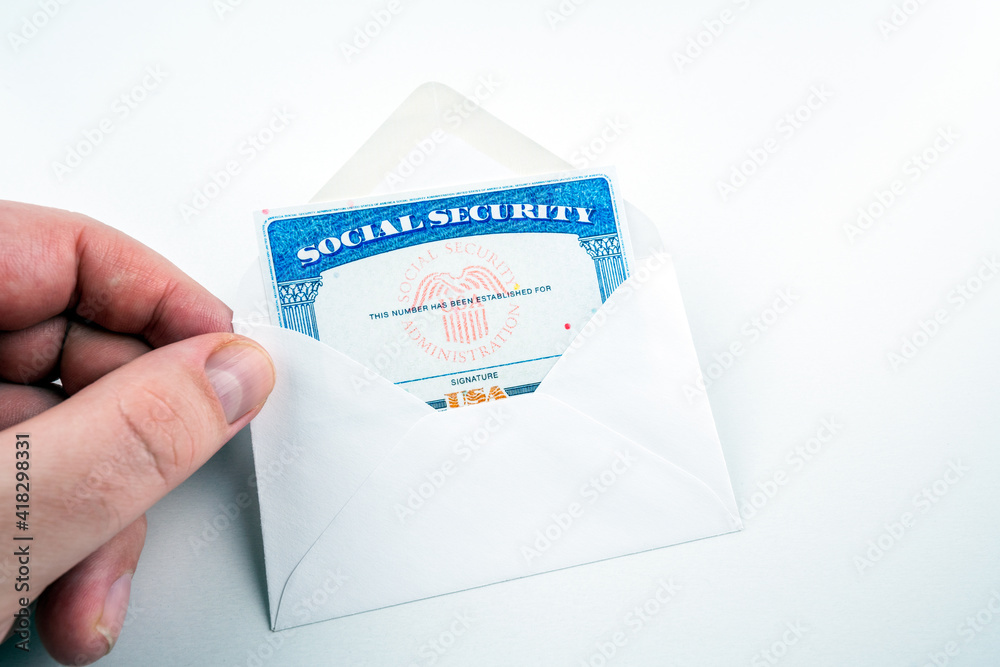 Hand holding Blank social security card in envelope isolated on white ...