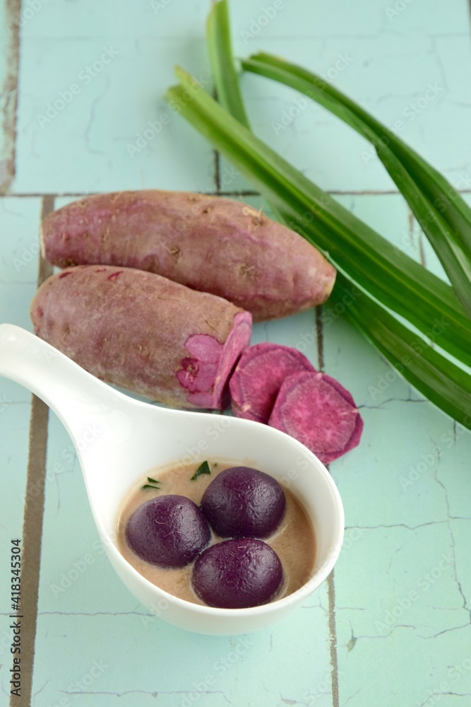 Kolak candil ubi ungu or purple sweet potato glutinous rice balls with ...