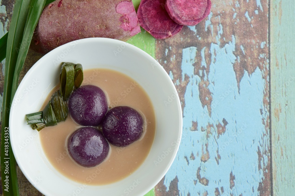 Kolak candil ubi ungu or purple sweet potato glutinous rice balls with ...