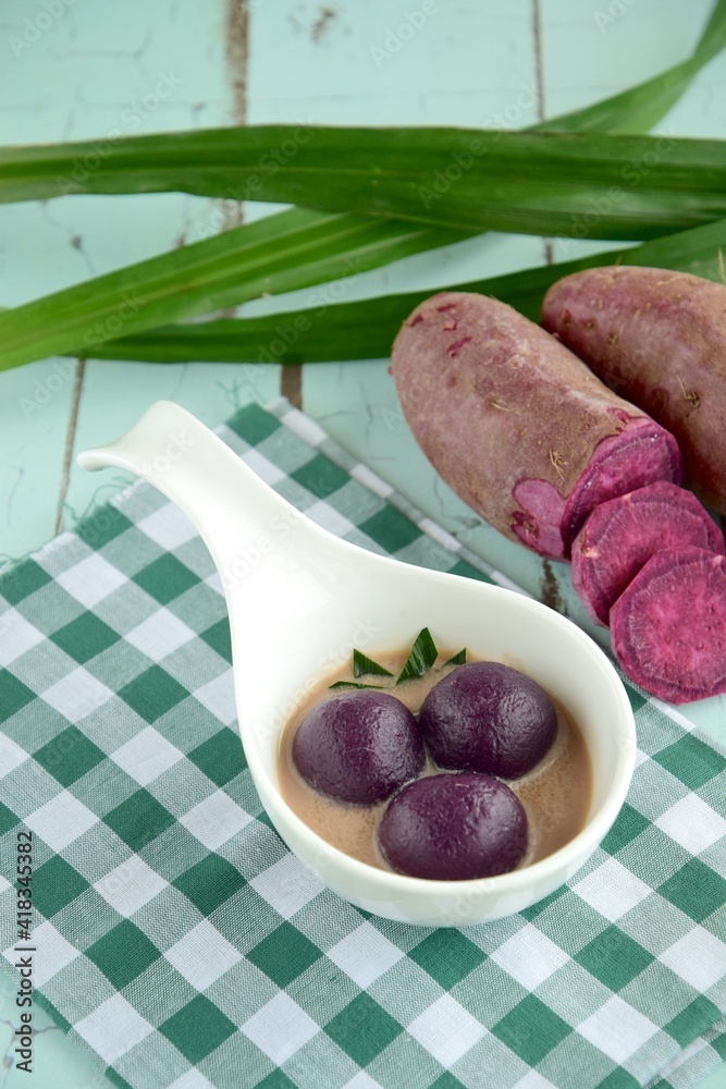 Kolak candil ubi ungu or purple sweet potato glutinous rice balls with ...