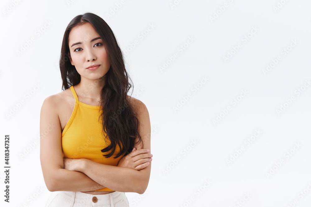 Skeptical and unimpressed serious-looking, determined young asian ...