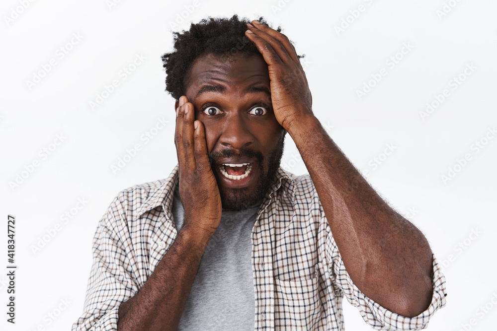 Guy scared, stare with panic and shock, touching face cant recognize ...