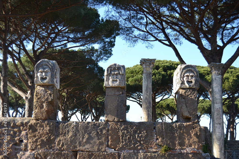 Ancient theater masks and statues in old amphitheater in ostia Antica ...