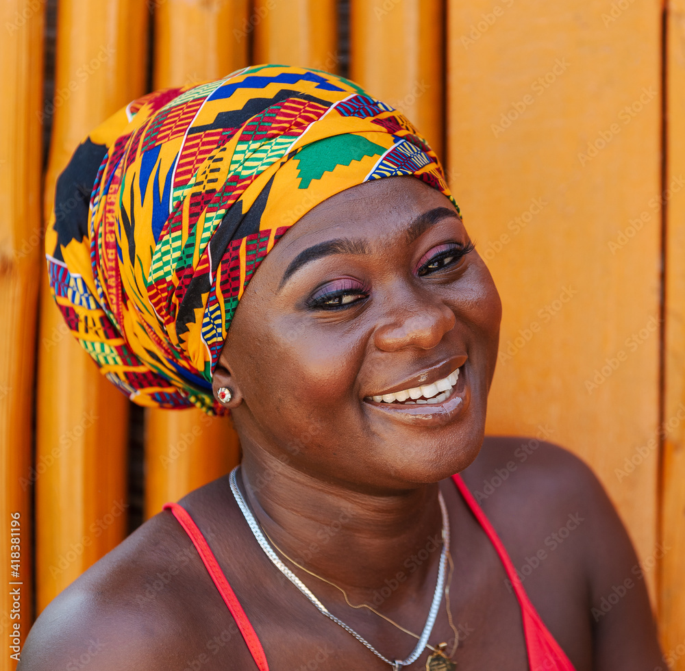 Happy African woman in the small village of Keta located in Ghana ...