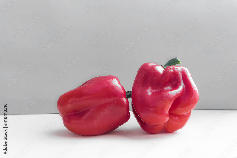 Ugly food. Red Bell pepper of irregular shape on a light background ...