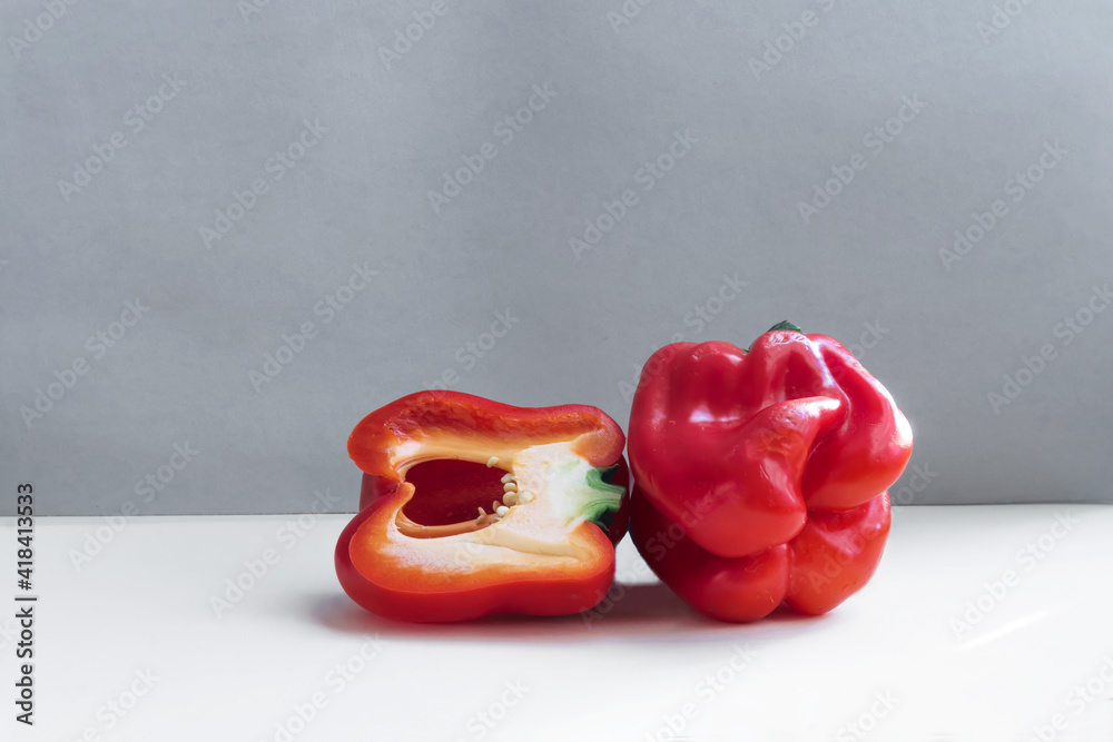 Ugly food. Red Bell pepper of irregular shape on a light background ...