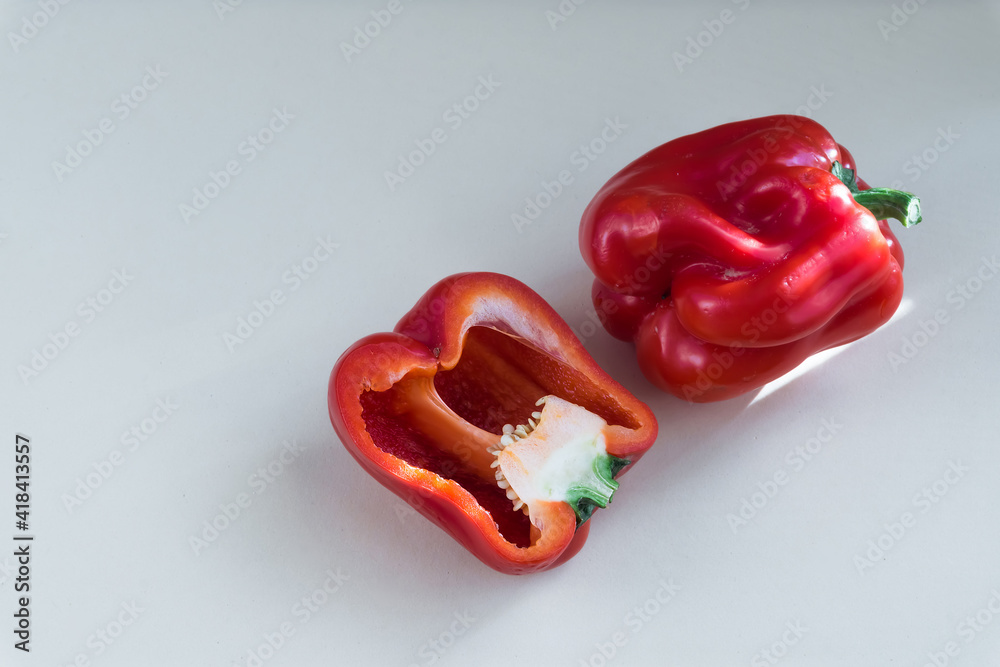 Ugly food. Red Bell pepper of irregular shape on a light background ...
