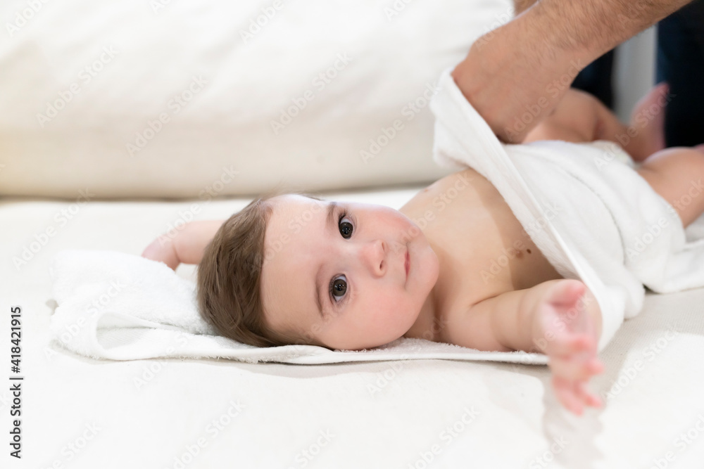 Cute baby boy getting diaper changed by dad Stock Photo | Adobe Stock