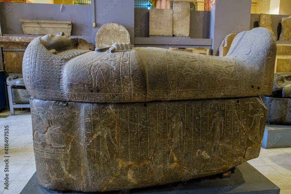 Ancient Egyptian sarcophagi and mummy caskets displayed in the Egyptian ...