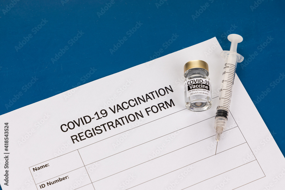 Covid-19 vaccination registration form with vial and syringe on blue ...