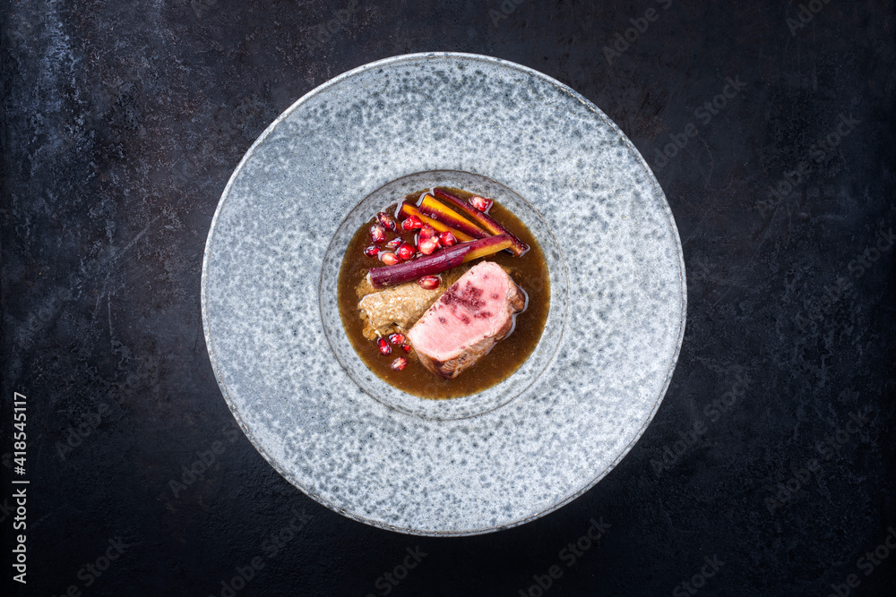 Modern style traditional roasted dry aged veal tenderloin with porcini ...