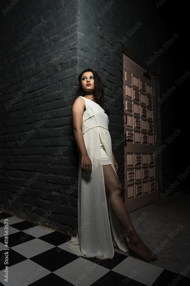 Indian girl, caucasian, brunette girl in white one leg cut gown with ...