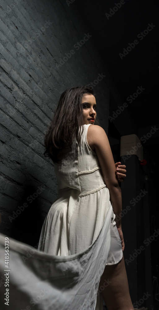 Indian girl, caucasian, brunette girl in white one leg cut gown with ...