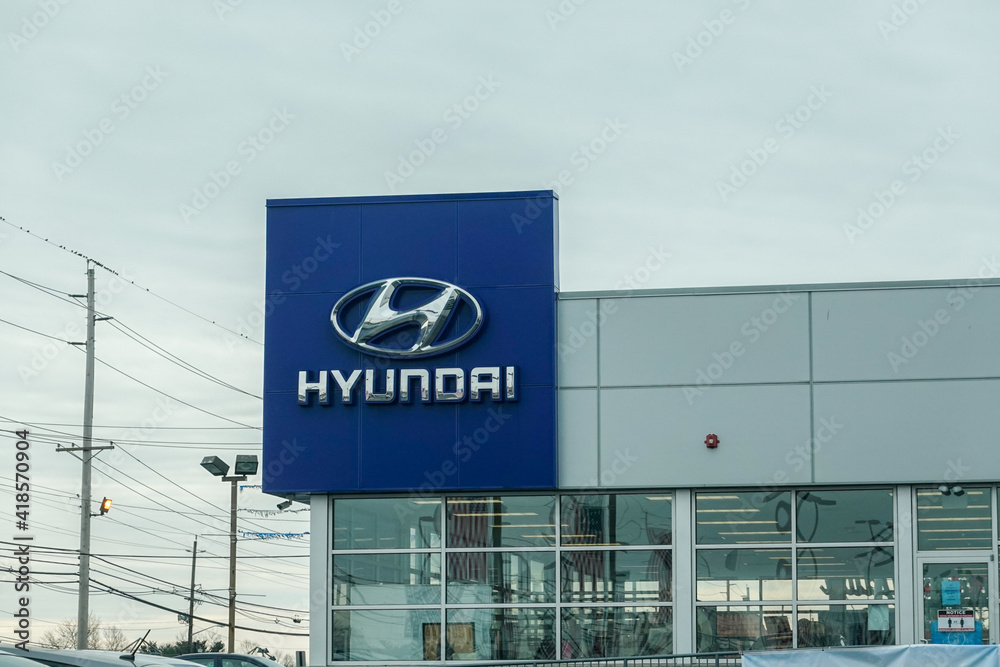 Hyundai car dealership sign with silver logo on a blue background Stock ...