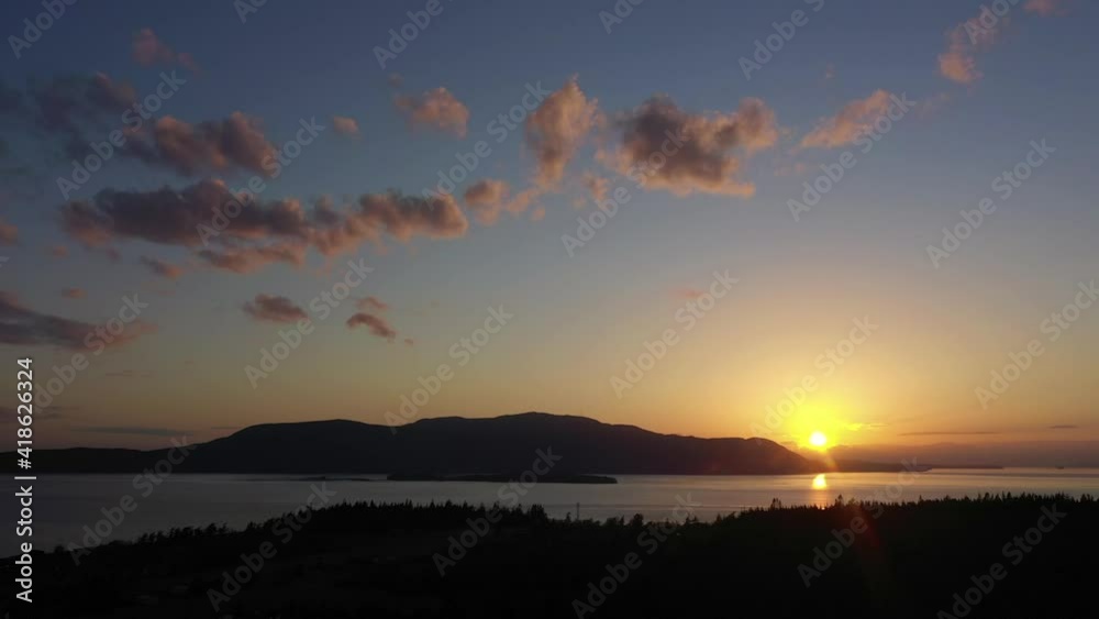 Beautiful Orcas Island Sunset in the Salish Sea. The sun sets behind ...