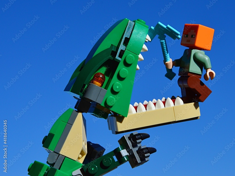 LEGO Minecraft Alex character with diamong pickaxe checking teeth of ...