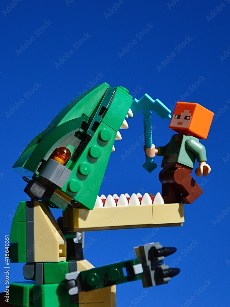 LEGO Minecraft Alex character with diamong pickaxe checking teeth of ...