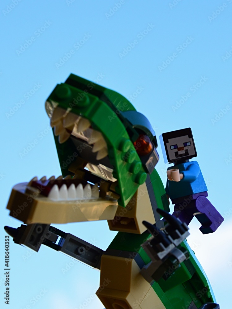 LEGO Minecraft figure of Steve character riding on angry Tyrranosaurus ...
