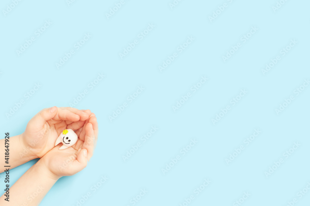 Hands holding a tooth, healthcare, love, family dentist, world day of ...