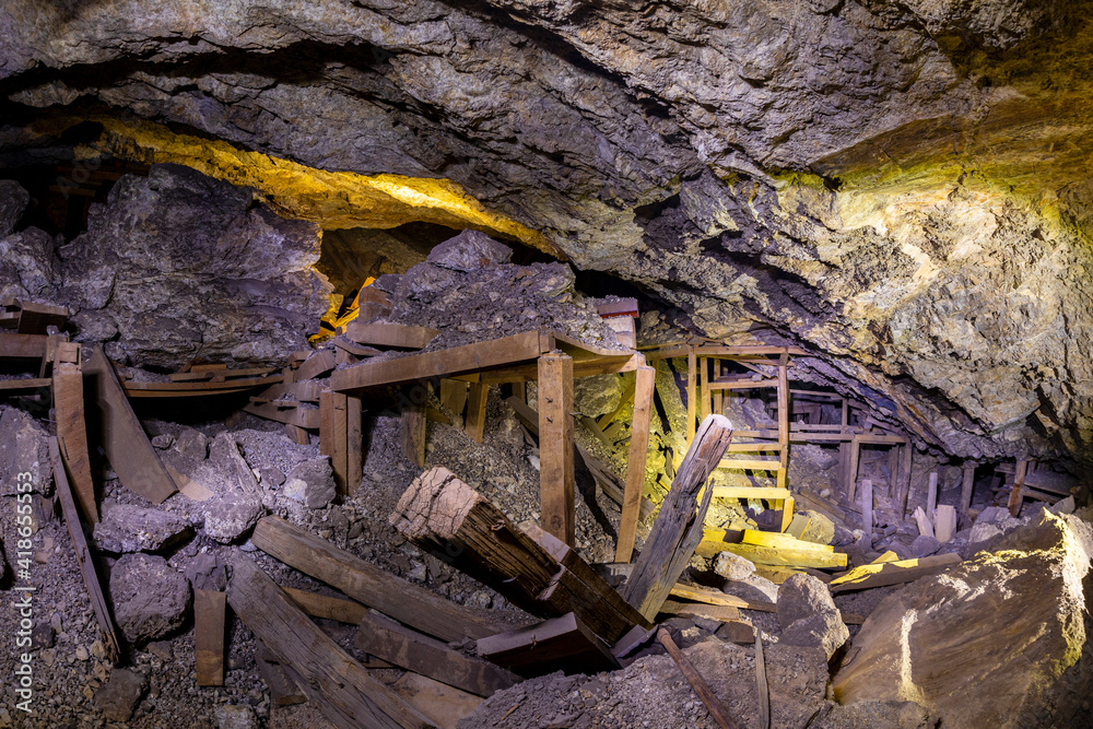Square timber framing inside an old and abandoned gold mine in ...