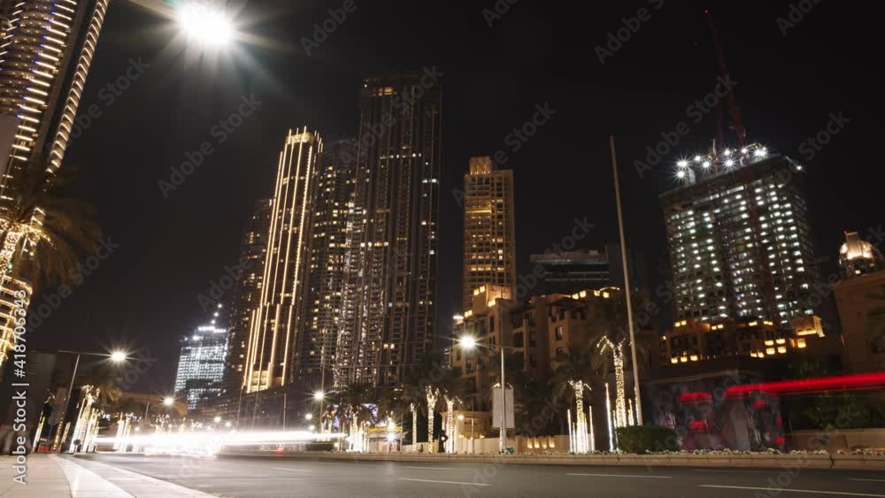 Night timelapse of a modern city, full of skyscrapers. High rise ...