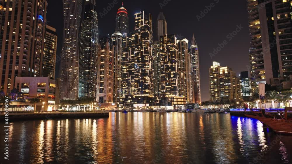 Night timelapse of a modern city, full of skyscrapers. High rise ...