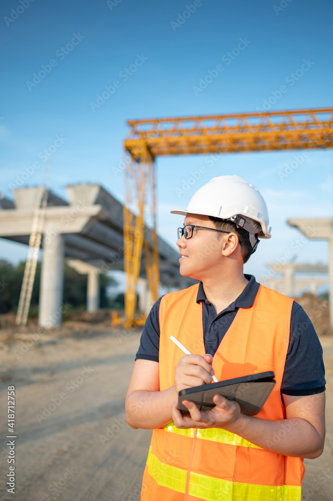 Smart Asian worker man or male civil engineer with protective safety ...