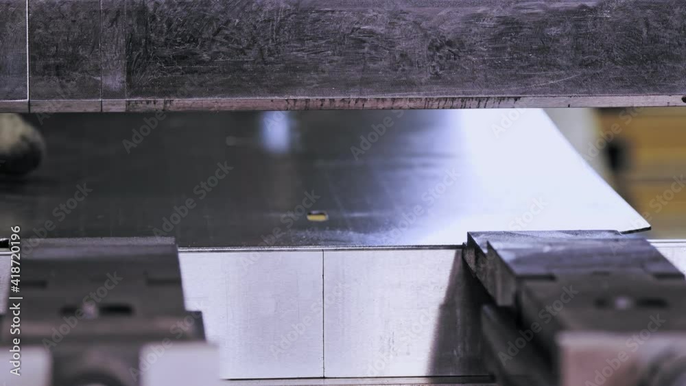 bending of sheet metal. close-up. automatic bending of sheet metal on ...
