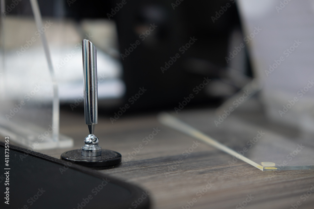 Office pen holder on reception desk Stock Photo | Adobe Stock