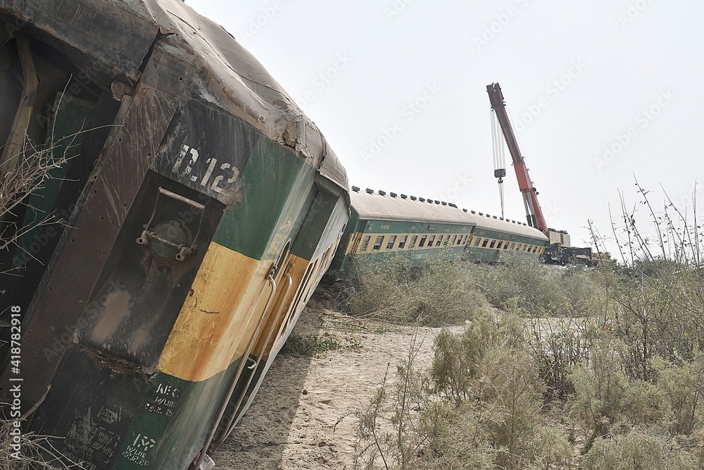 shows a derailed train in Sukkur district of, Pakistan. A woman was ...