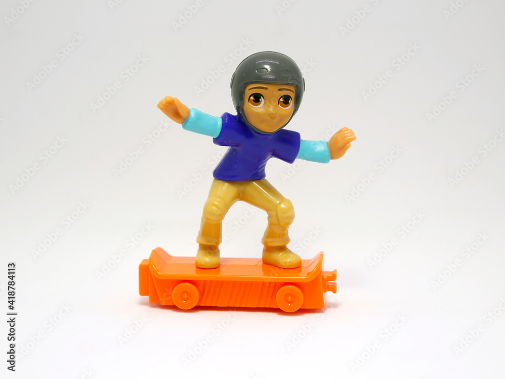 Latin boy on skateboard with safety helmet. Polly Pocket doll. Friends ...