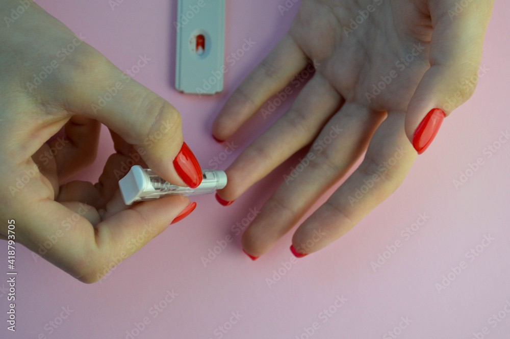 coronavirus test on a pink matte background. medical procedure. the ...