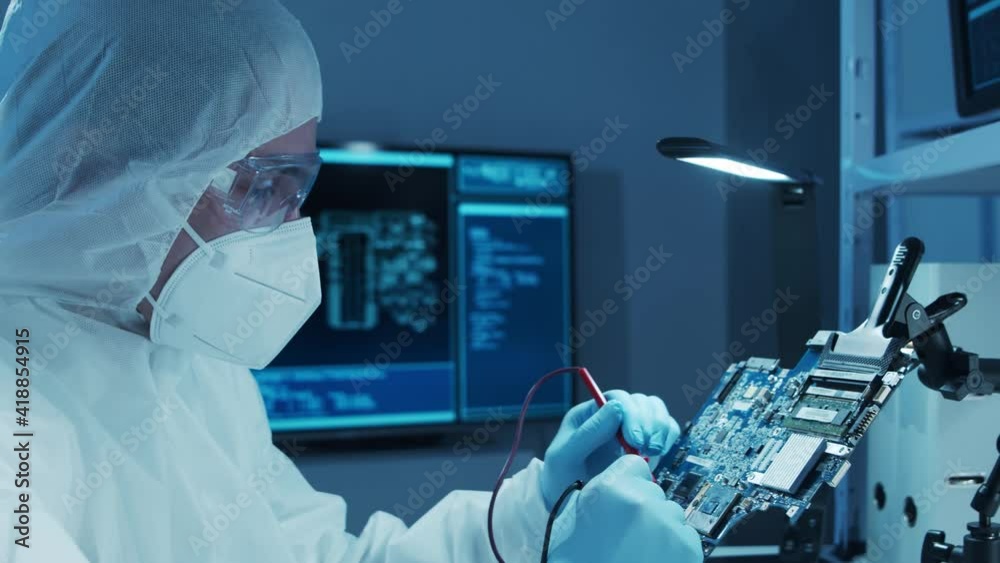 Microelectronics engineer works in a modern scientific laboratory on ...