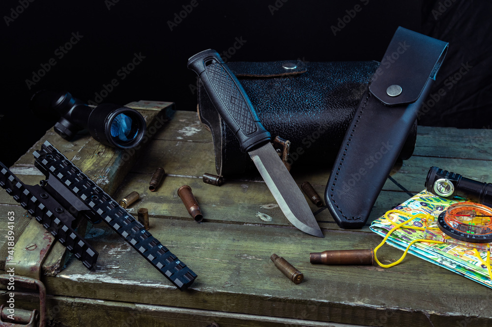 An army black knife with a fixed blade. Knife and leather sheath ...