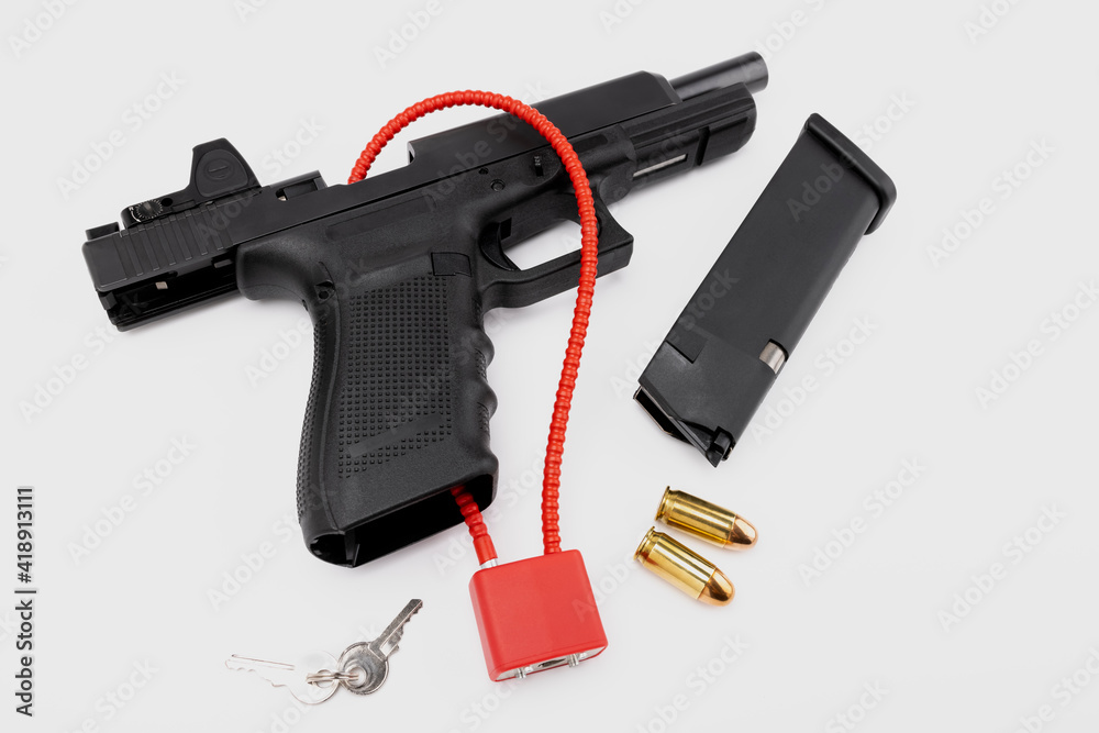 Locked disarmed and secured automatic gun on white background Stock ...