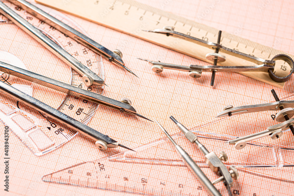 Drawing tools, ruler and protractor on graph paper. Close up Stock ...