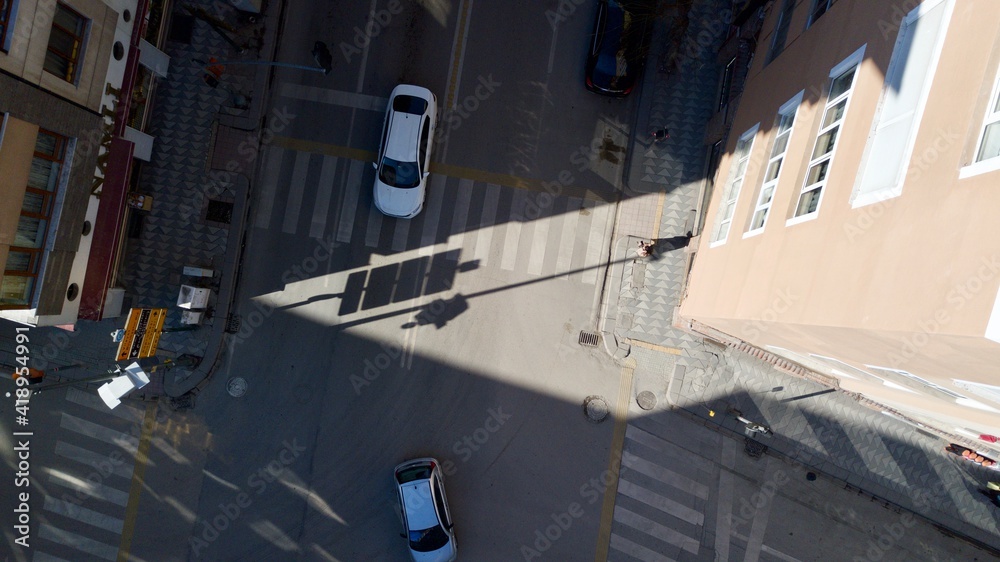 Aerial view of crosswalk and intersection road at the city center. The ...