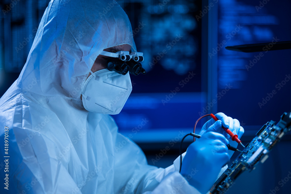 Microelectronics engineer works in a modern scientific laboratory on ...
