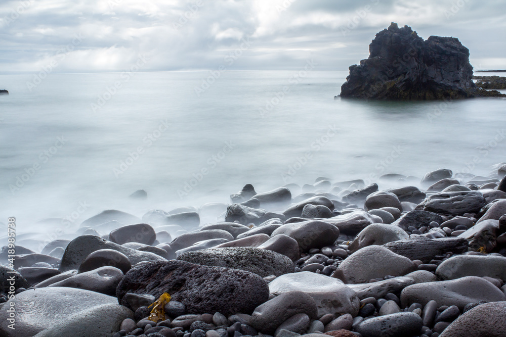 Time exposure of stony beach at Hellnar, Snaefellsnes National Park Stock Photo | Adobe Stock
