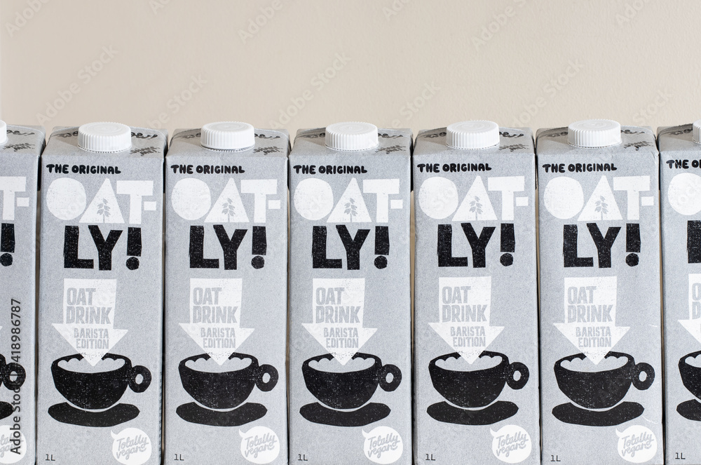 Oatly milk cartons in a row. Oatly is a dairy free vegan milk ...