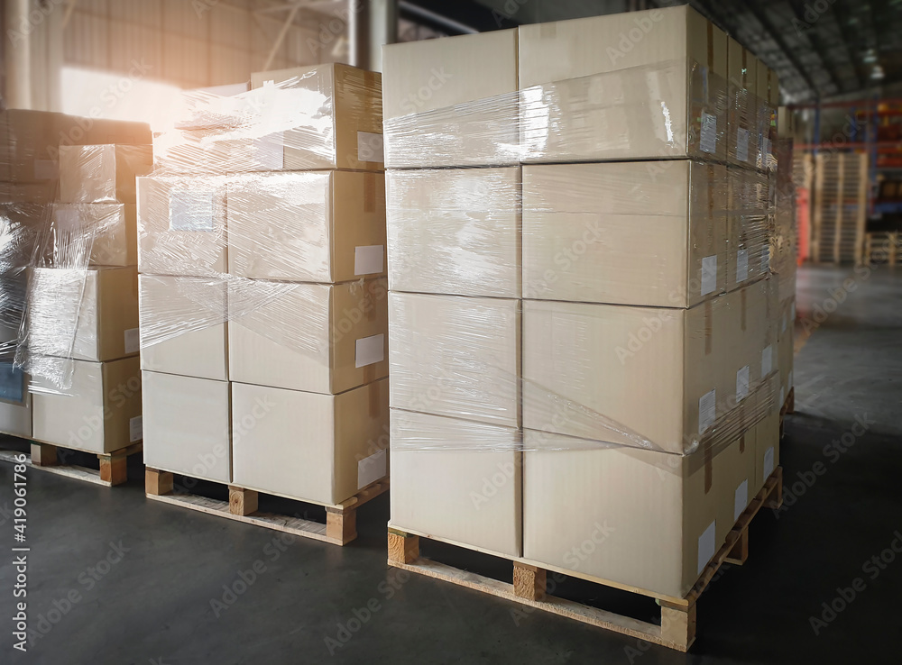 Stacked of Cardboard Boxes Wrapped Plastic on Pallet Rack. Interior of ...