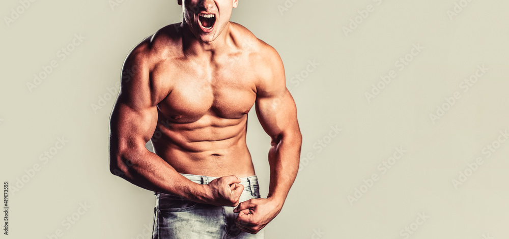 Screaming man with well trained body, biceps, abs and pecs and wearing ...