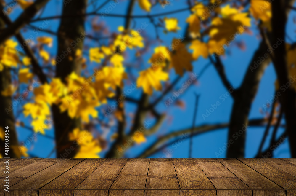 Beautiful autumn background with empty wooden deck table. Ready for ...
