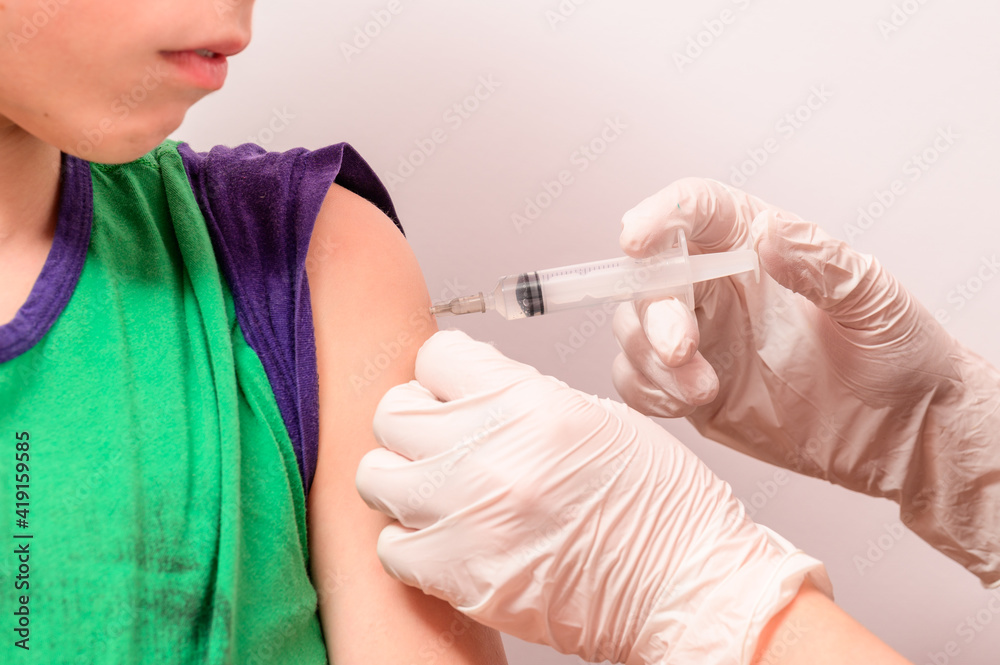 Vaccination of a child to develop immunity to the disease, the ...